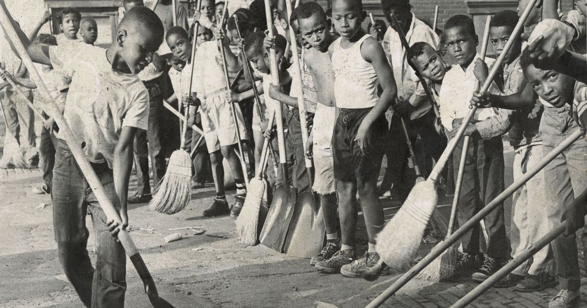 Boys Cleaning Up Street